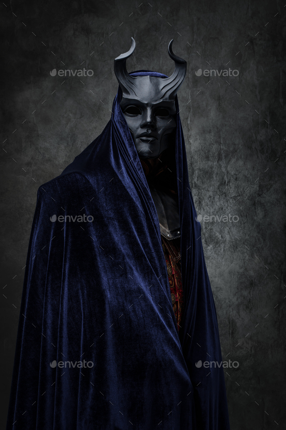 Evil cultist with dark cloak against dark background Stock Photo by ...
