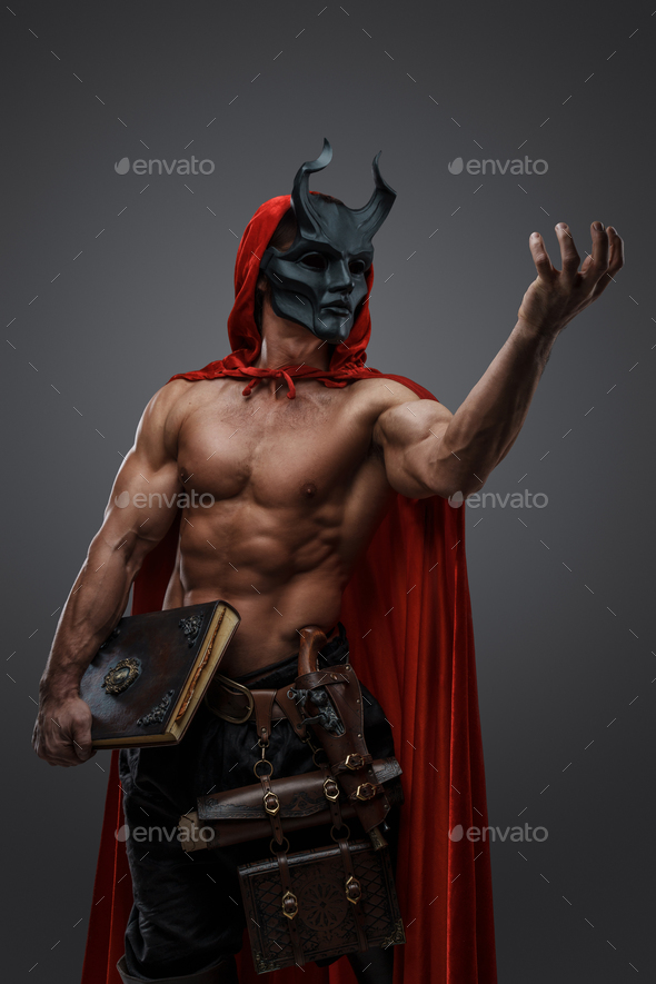 Powerful wizard of dark cult with red cloak and black mask Stock Photo ...