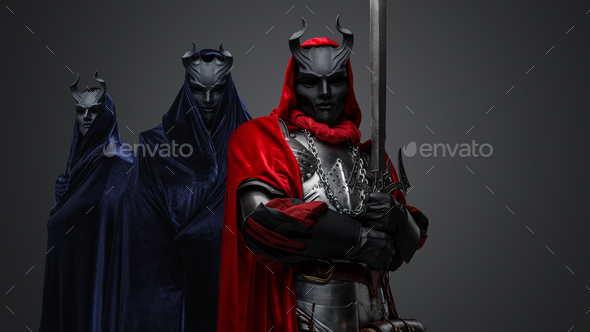 Two cultists in blue robes and their leader with sword Stock Photo by ...