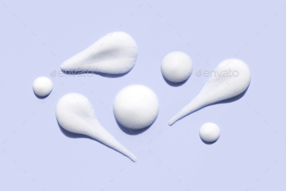 texture foam mousse foam cosmetic smear sample on pastel purple ...