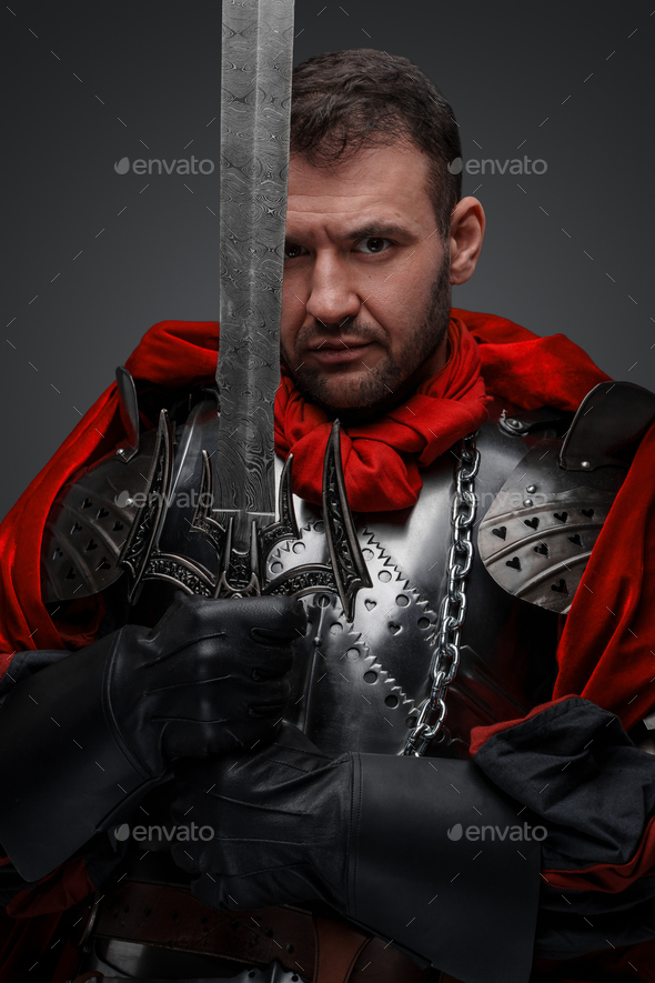 Medieval dark knight with red cape and sword Stock Photo by fxquadro
