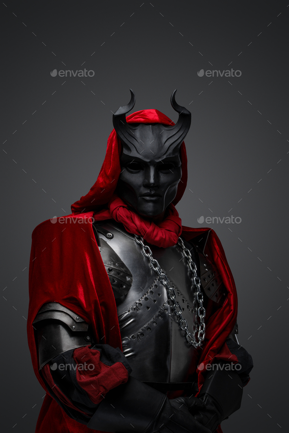 Mysterious dark knight with devil mask against gray background Stock ...