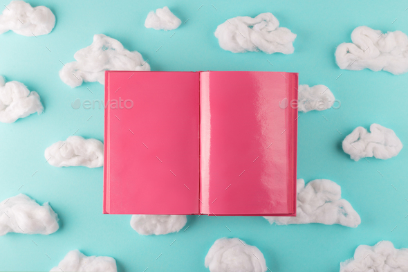Writer desk concept. Pink open book with clouds. Top view. Stock Photo ...