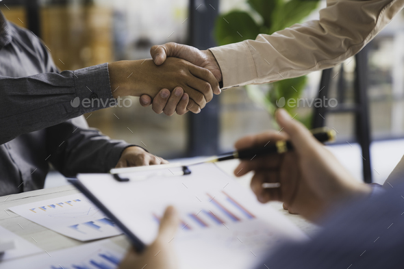 Successful businessmen handshaking after a good deal. Photo two man ...