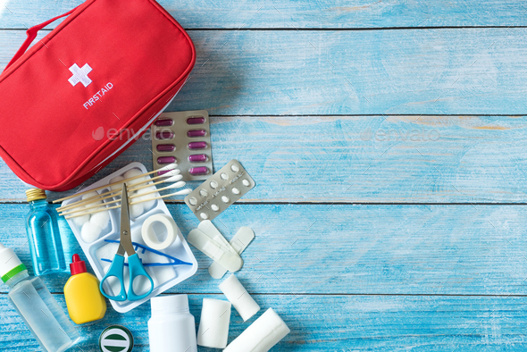 First aid kit with medical equipment and emergency objects at home or ...