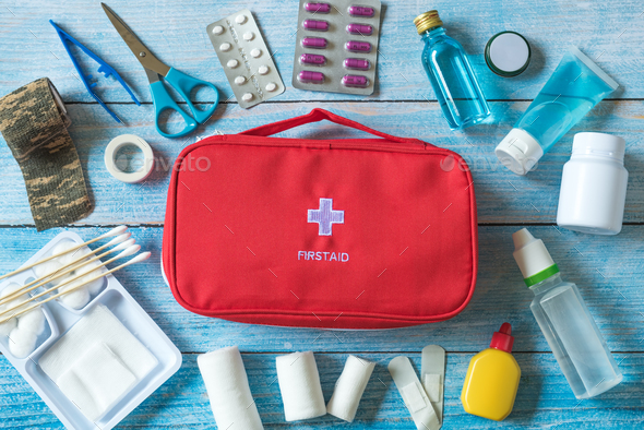First aid kit with medical equipment and emergency objects at home or ...