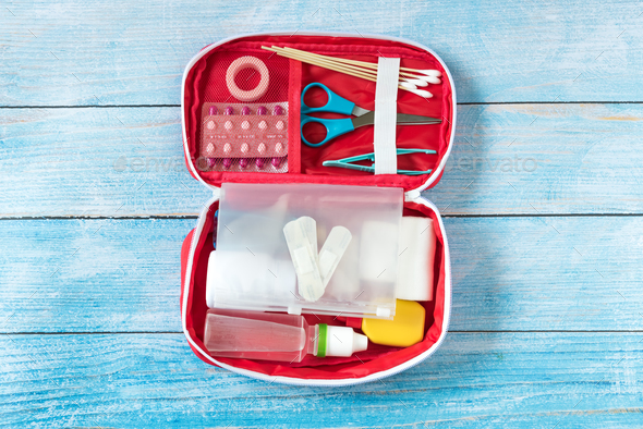 First aid kit with medical equipment and emergency objects at home or ...