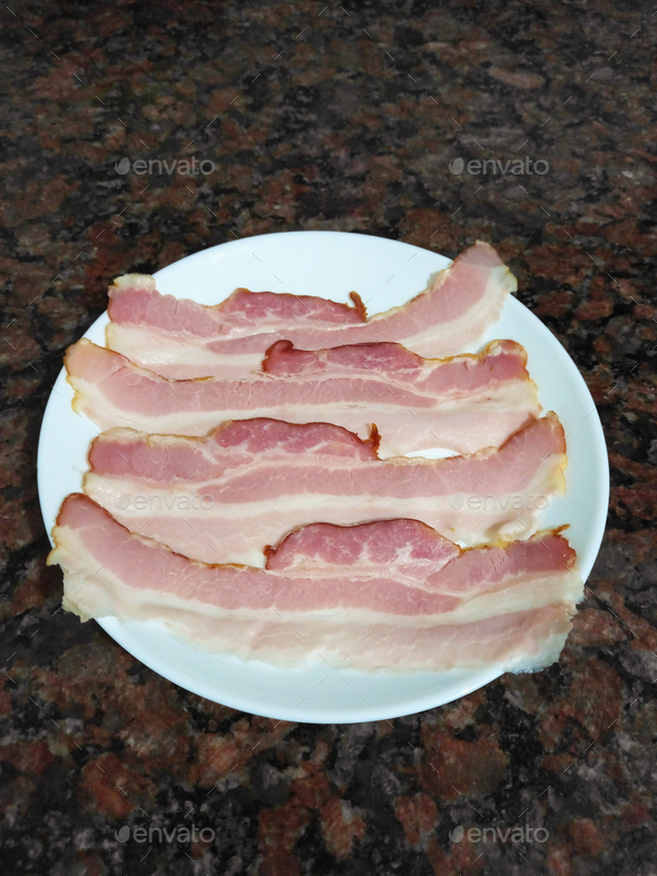 Cold meat. Tasty thin slices of smoked pork side bacon (panceta) for ...