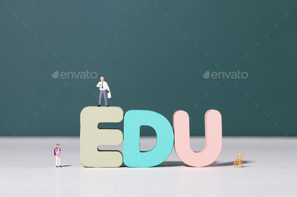 View of teacher and student figurines standing around EDU letters Stock ...