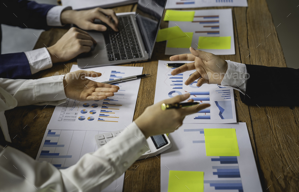 Financial teamwork with Marketing and Accounting, using calculator to ...