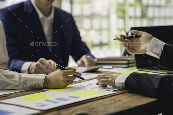 Financial teamwork with Marketing and Accounting, using calculator to ...