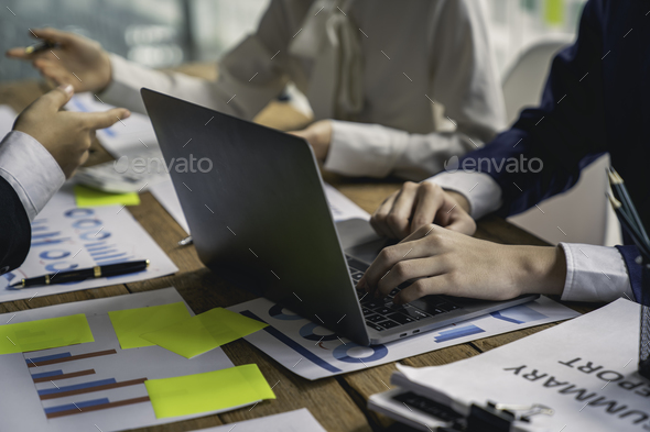 Financial teamwork with Marketing and Accounting, using calculator to ...