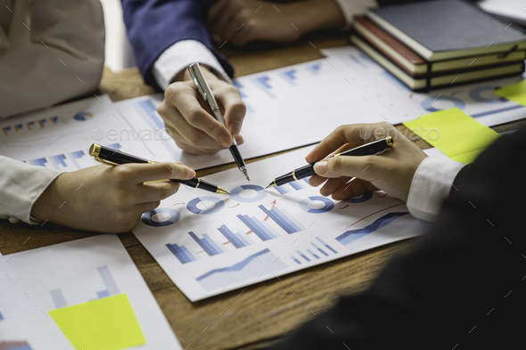 Financial teamwork with Marketing and Accounting, using calculator to ...