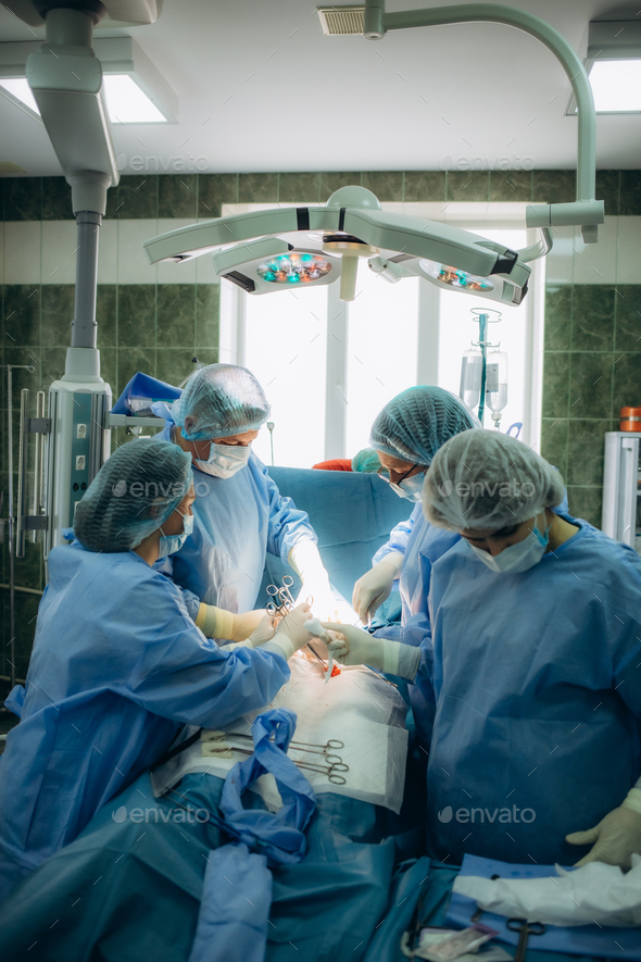 Surgical team performing surgery operation. Doctor performing surgery ...