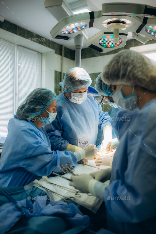 Surgical team performing surgery operation. Doctor performing surgery ...