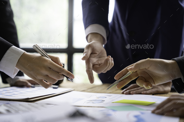 Business people using pen,tablet,notebook are planning a marketing plan ...