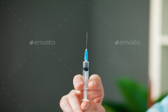 Doctor comes into a solution for injection in a syringe Stock Photo by ...