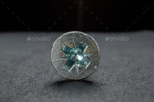 Front close view of iron tack on isolated black background with free ...