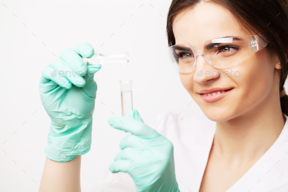 Medicine concept, doctor female in clinic holding test tubes with ...