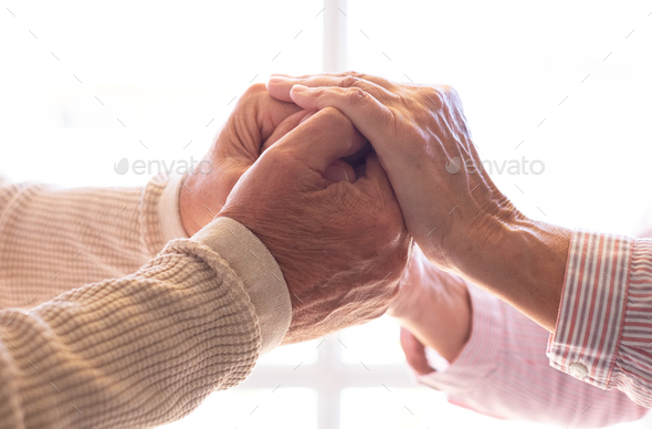 Old people holding hands close up view, senior retired family couple ...