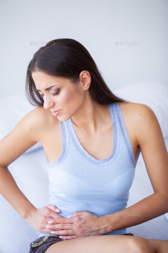 Pain stomach. Woman having painful stomachache,Female suffering from ...