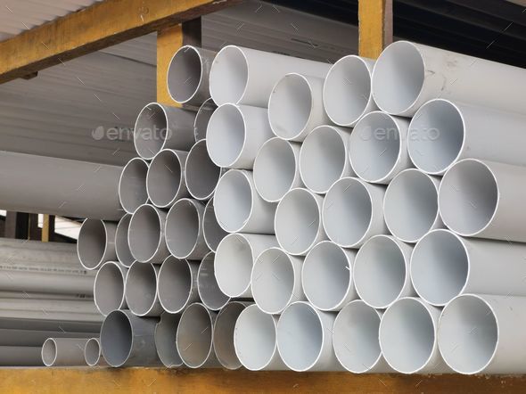 Various type and size pvc pipes stack on shelf. v Stock Photo by wirestock