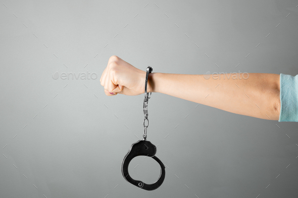hand with handcuff Stock Photo by FabrikaPhoto | PhotoDune