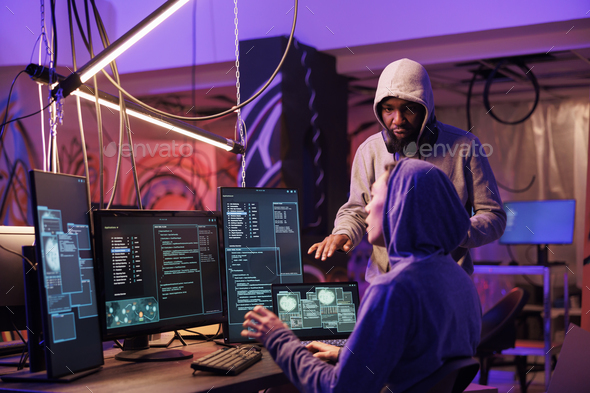 Hackers working together and coding Stock Photo by DC_Studio | PhotoDune