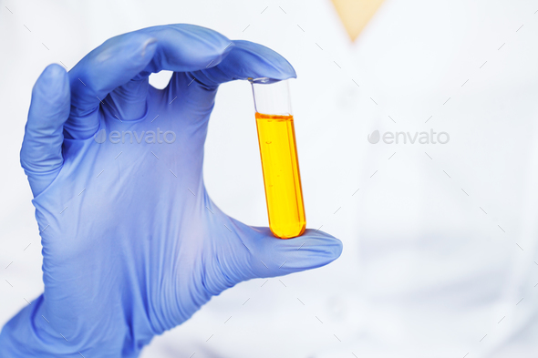 Scientist is Doing Her Research. Scientist Hold Test Tube With Liquid ...