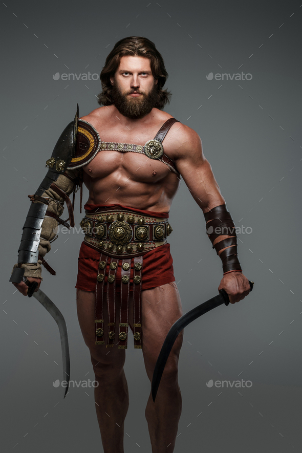 Gladiator with long hair and a beard, donning light armor wearing two ...