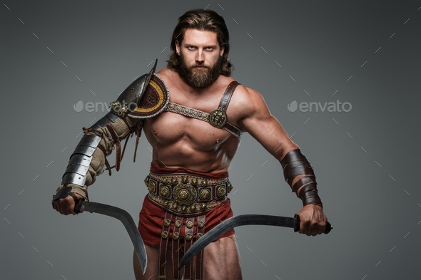 Gladiator with long hair and a beard, donning light armor wearing two ...