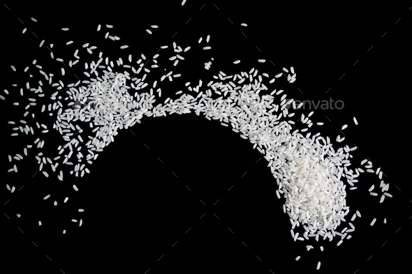 Raw white rice splash on black background. Uncooked rice explosion ...