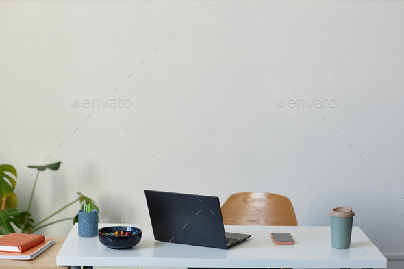 Minimal background image of simple workplace with laptop on white Stock ...