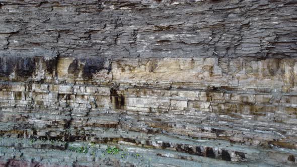 geological rock strata, colored stratified rock layers in the ...