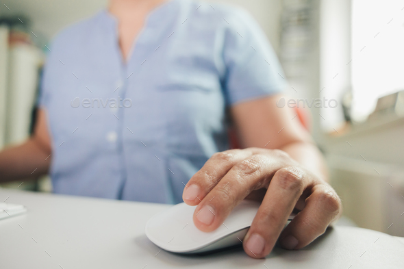 Left-handed woman's hands working with computer mouse Stock Photo by ...