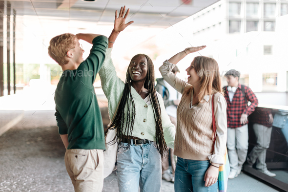 university students meet on campus and greet each other with a clap ...