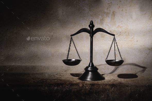 Antique-style metal balance scale featuring two opposing balance arms ...