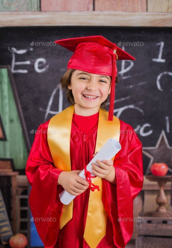 Adorable little boy proudly displaying a VPK diploma during ...