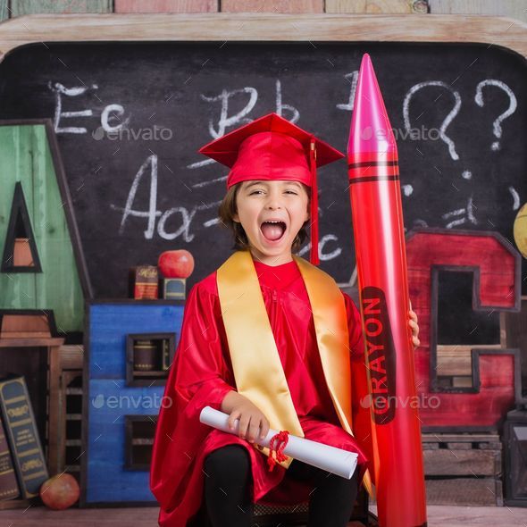 Adorable little boy proudly displaying a VPK diploma during ...