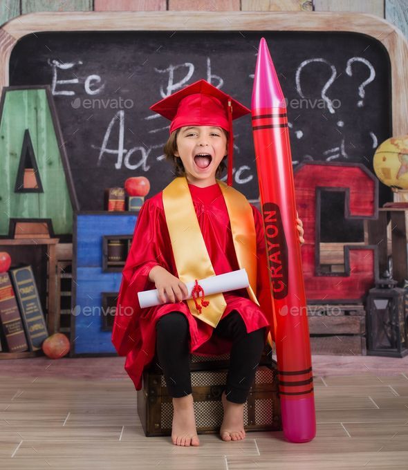 Adorable little boy proudly displaying a VPK diploma during ...
