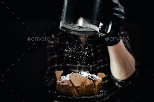 Chef spilling sugar powder on cake Stock Photo by wirestock | PhotoDune