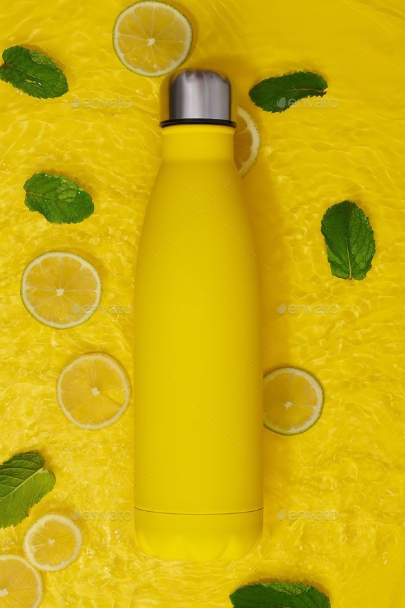 Yellow thermos with sliced lemons on a bright yellow background. Stock ...