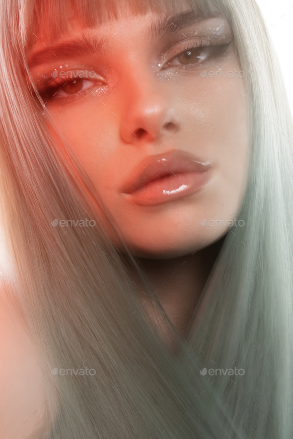 High fashion model face woman in colorful bright neon UV blue and red ...