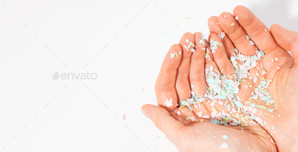 Shot of microplastics lay on human hand. Concept of water pollution and ...