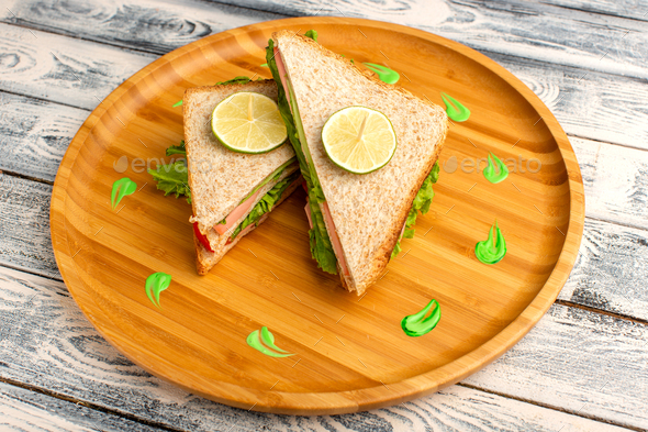 front view tasty sandwiches on the wooden desk and grey rustic ...