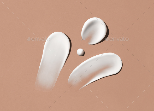 smears samples of various cosmetic textures on a beige background Stock ...