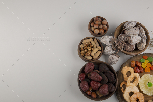 Dry fruits and snacks in multiple wooden platters and saucers Stock ...