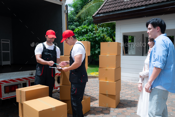 Delivery man delivering parcel to customer at home. Delivery service ...