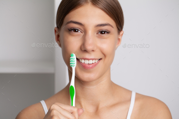 Happy Lady Brushing Teeth With Toothbrush Standing In Bathroom Stock ...