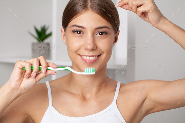 Happy Lady Brushing Teeth With Toothbrush Standing In Bathroom Stock ...